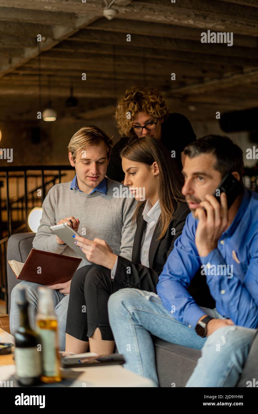 Four amazing business people are making the project Stock Photo - Alamy