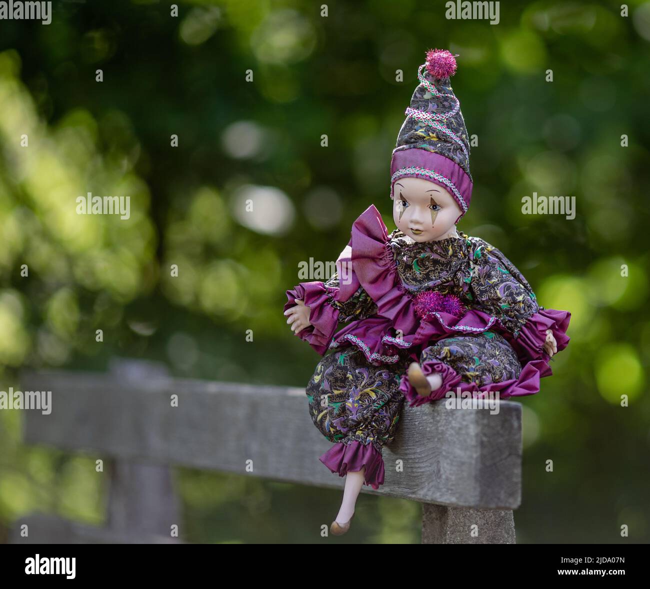 Amazing realistic vintage porcelain doll, toy, harlequin, selective ...