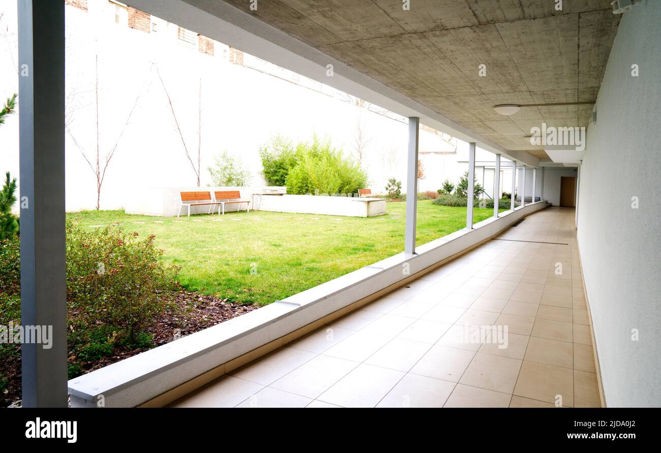 outdoor empty corridor with garden in the modern office building Stock ...