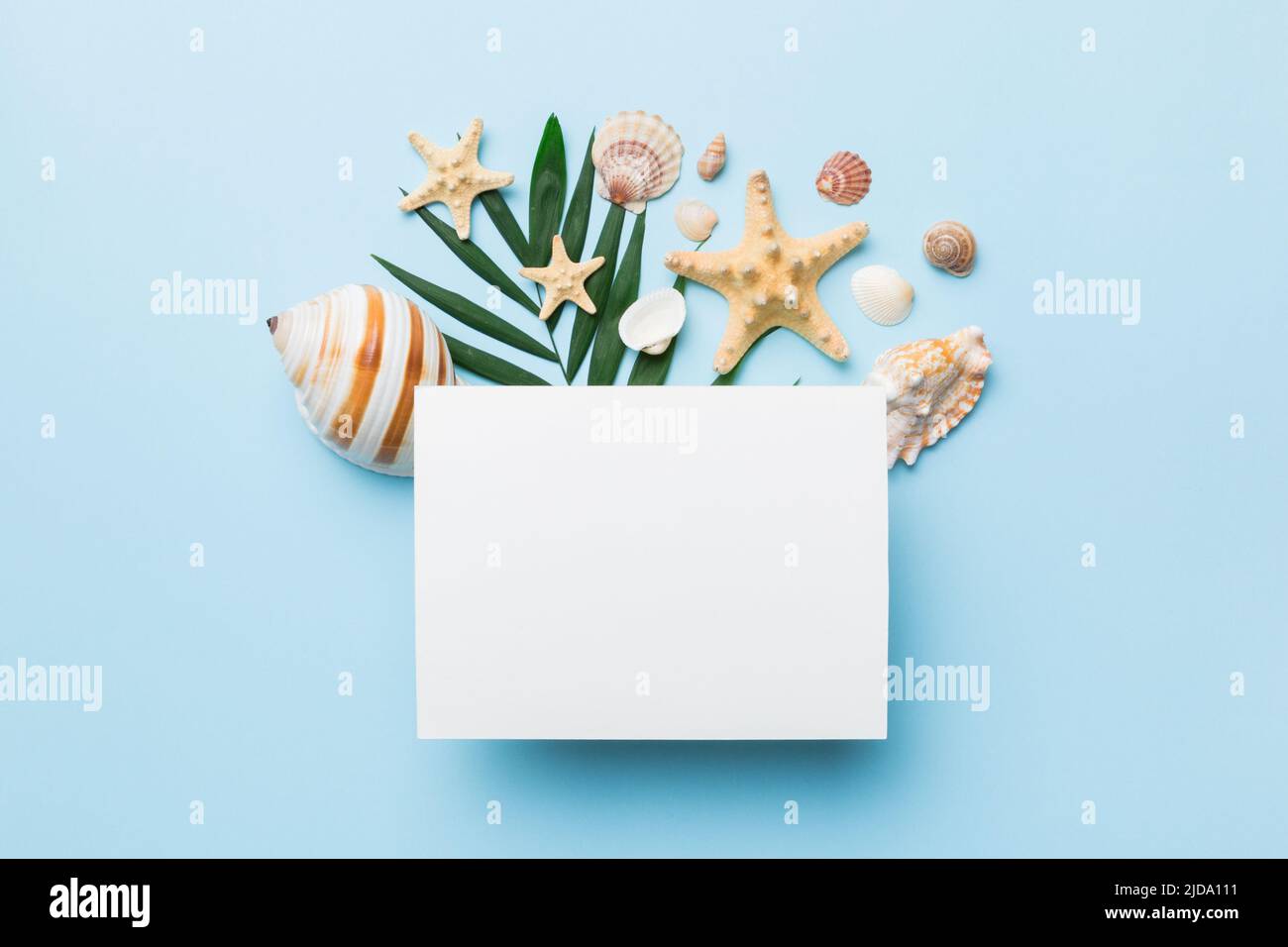 Summer time concept with blank greeting card and blank white paper on ...