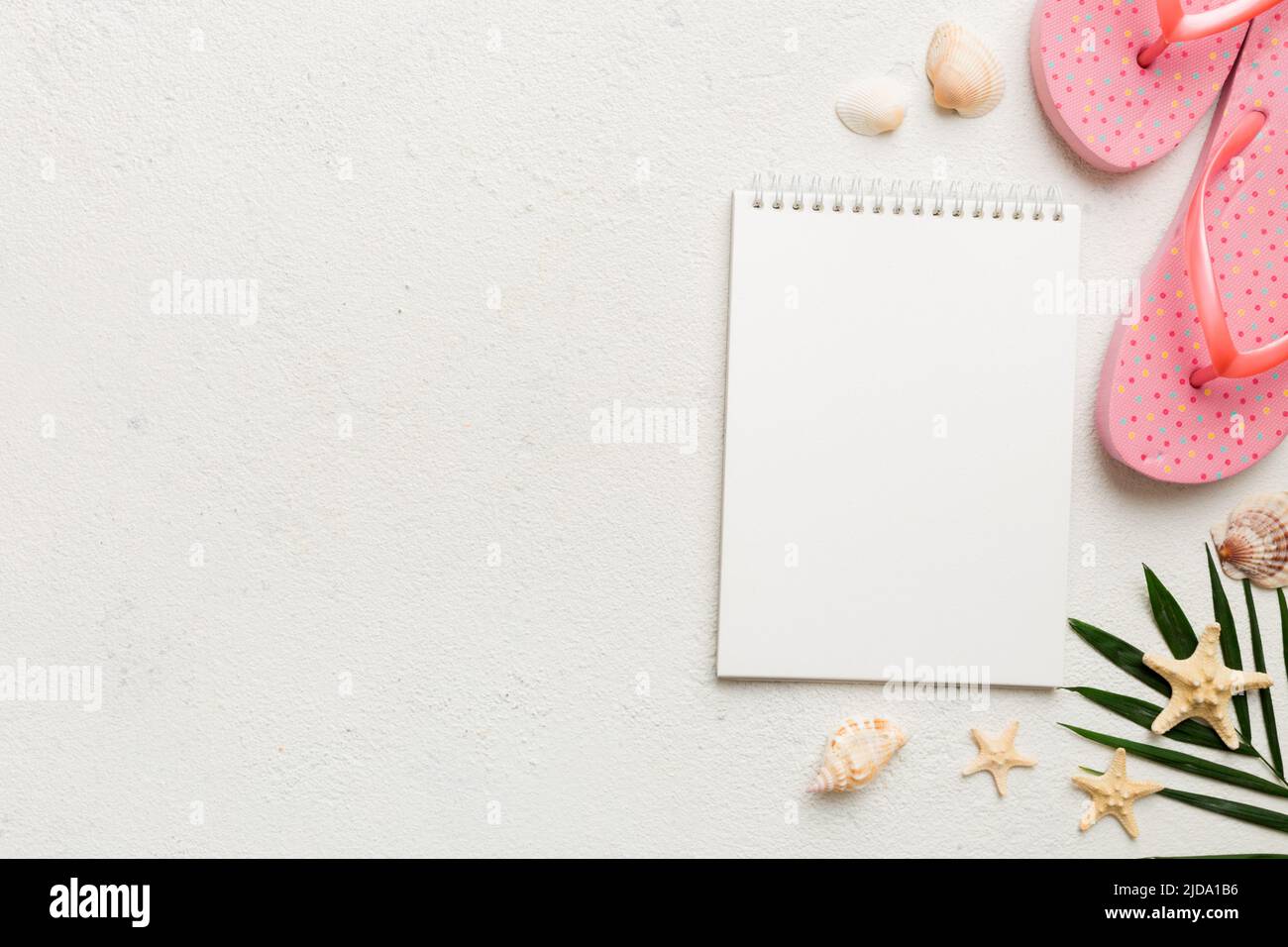 Blank writing book with summer beach accessories on background, copy ...