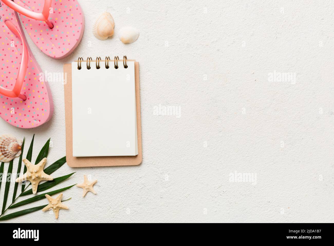 Blank writing book with summer beach accessories on background, copy ...