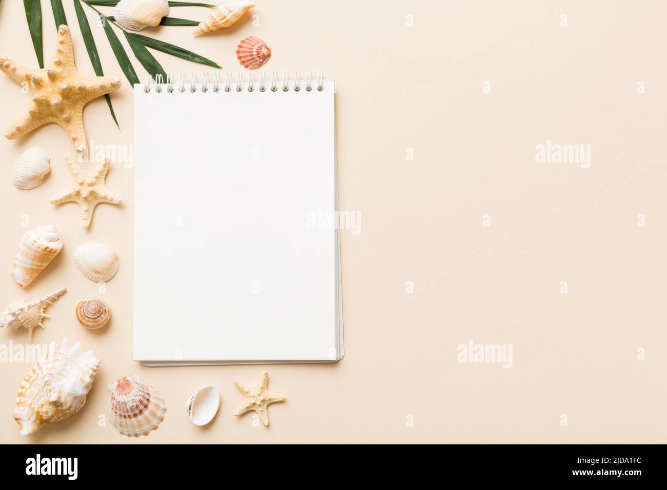 Blank writing book with summer beach accessories on background, copy ...
