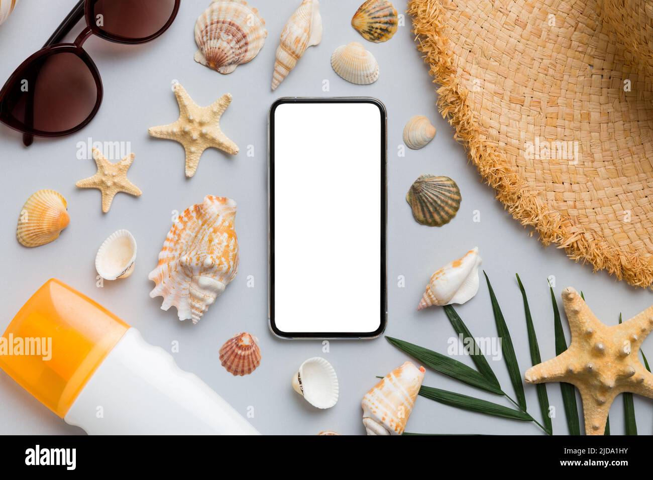 Flat lay composition with Phone and beach accessories on colored ...
