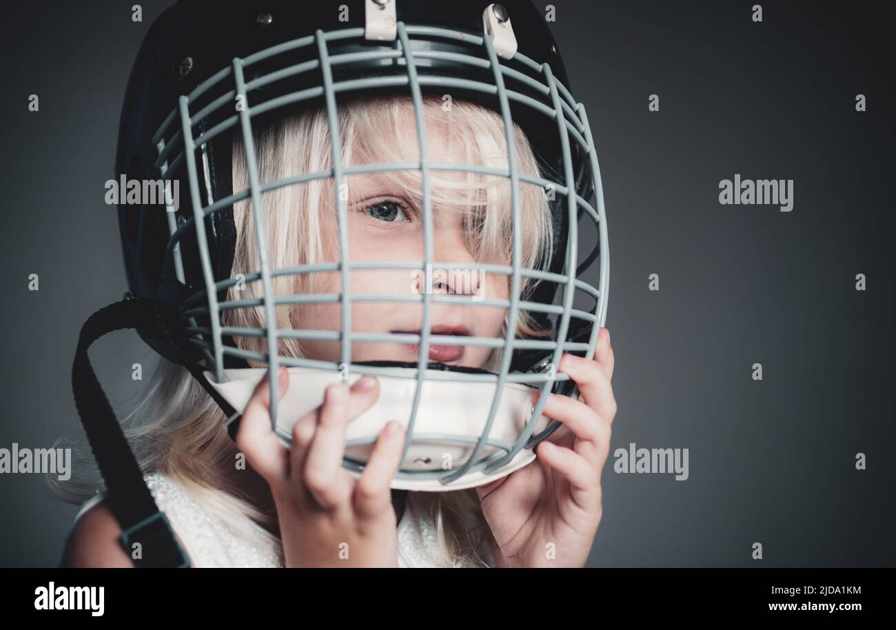 Girl cute child wear hockey helmet close up. Safety and protection ...