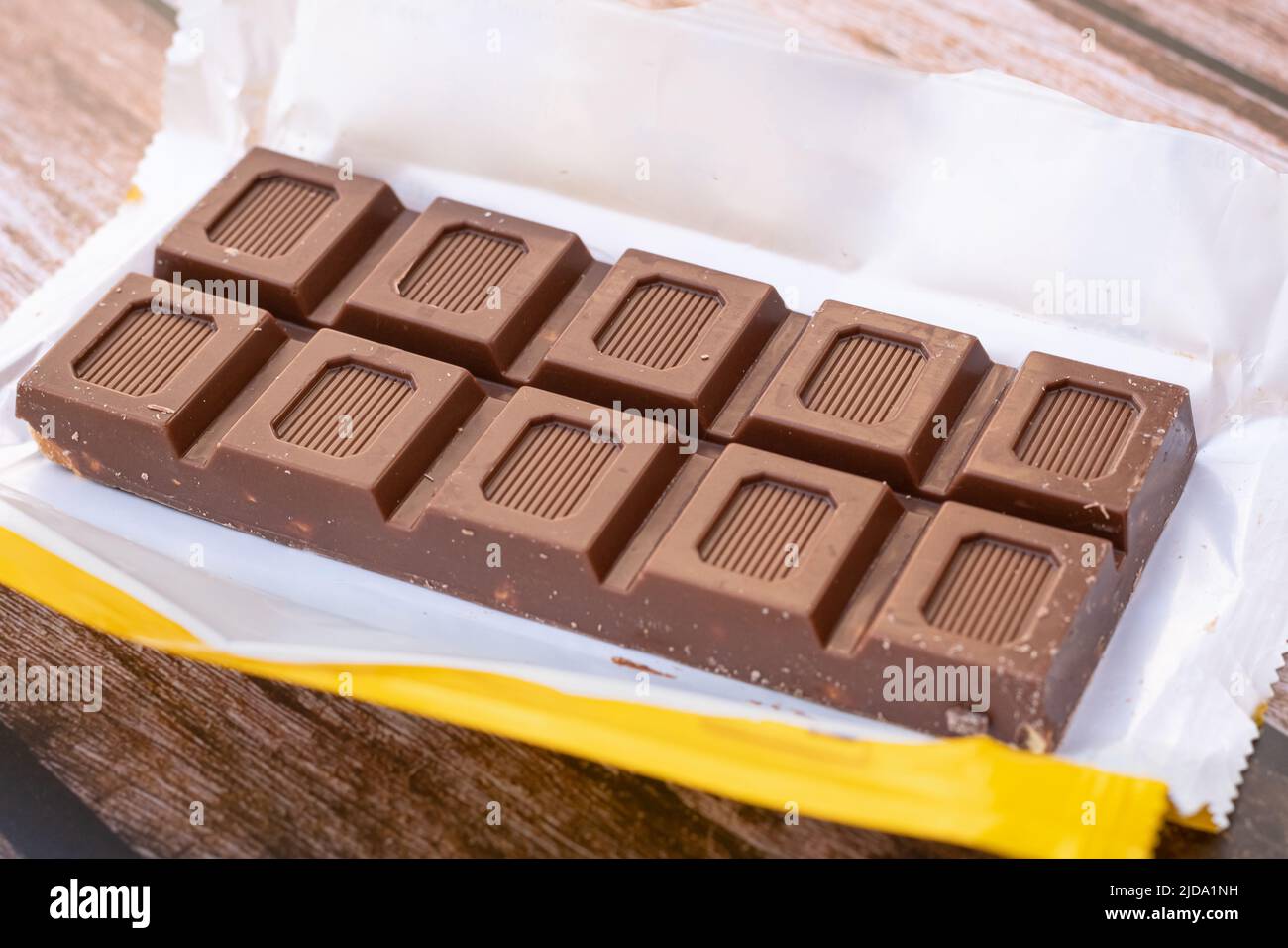 LARGE BAR OF DARK CHOCOLATE, ON A WRAPPER Stock Photo - Alamy