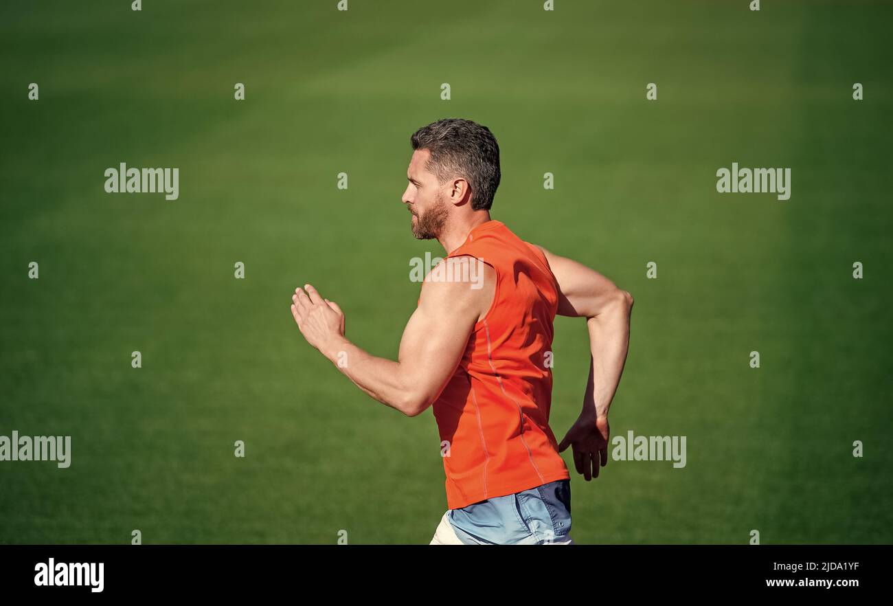 sport and endurance. outdoor stadium sprint. physical training. athletic guy run Stock Photo - Alamy