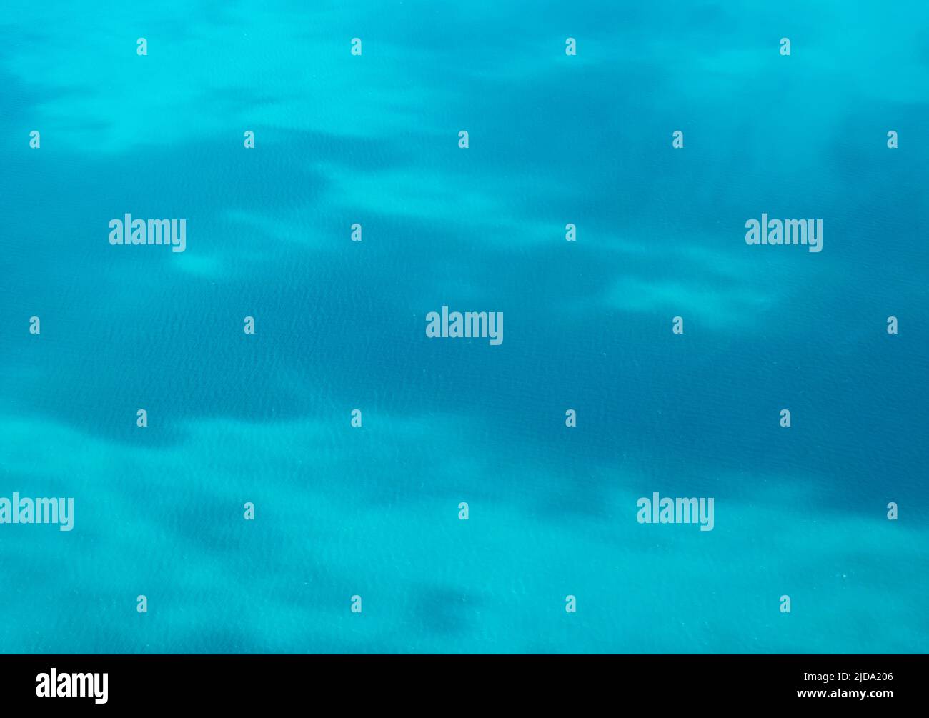 Beautiful blue hues seen from a plane flying over the waters of Belize ...