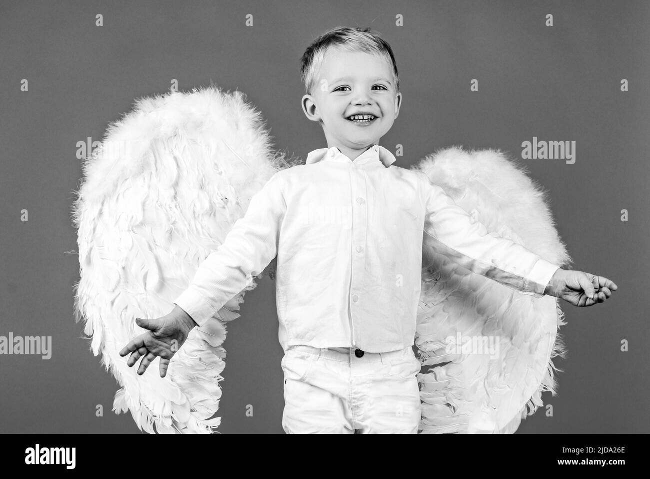 Portrait of innocent angel looking it with love Stock Photo - Alamy
