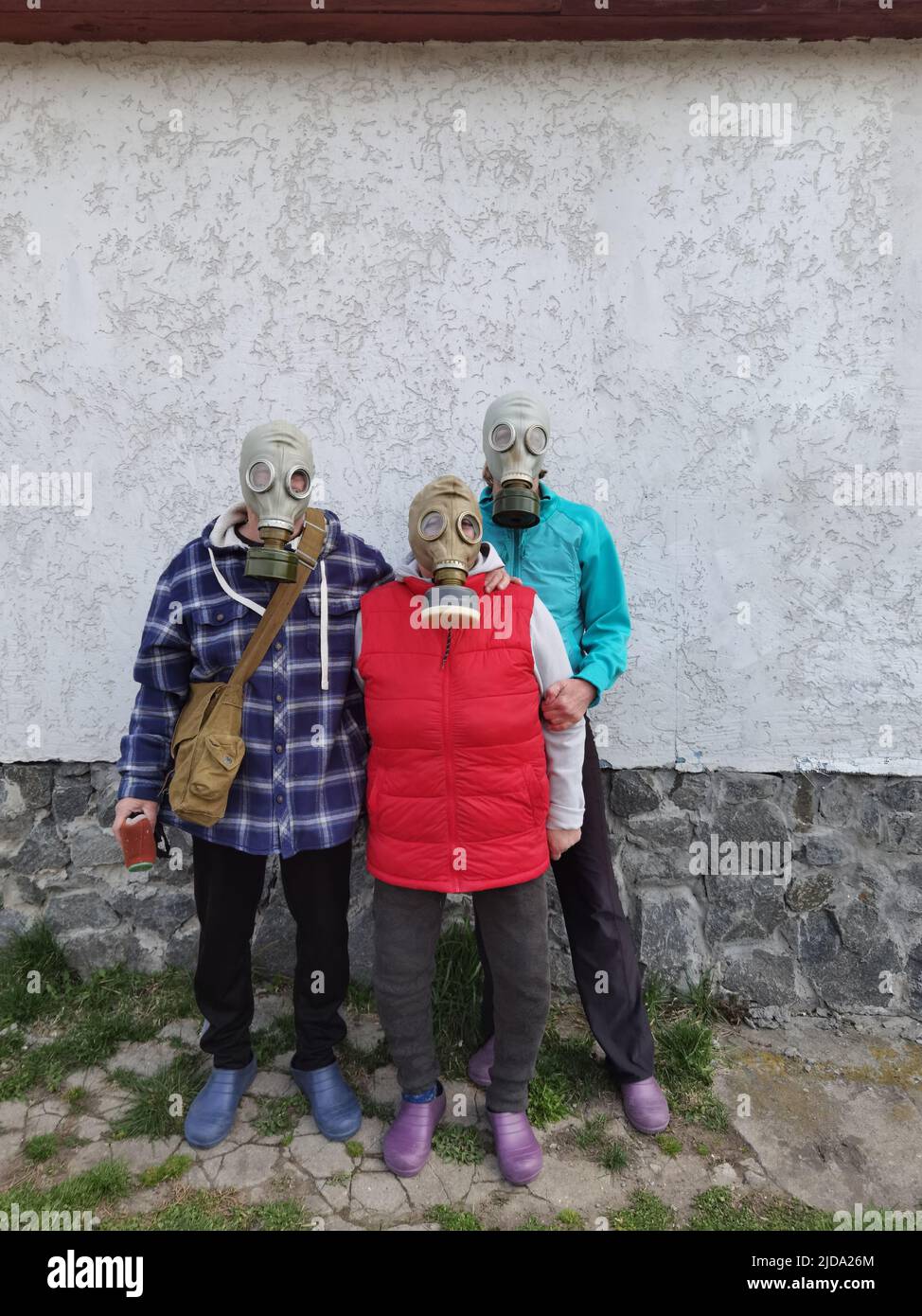 Gas masks. Three people with gas masks Stock Photo - Alamy