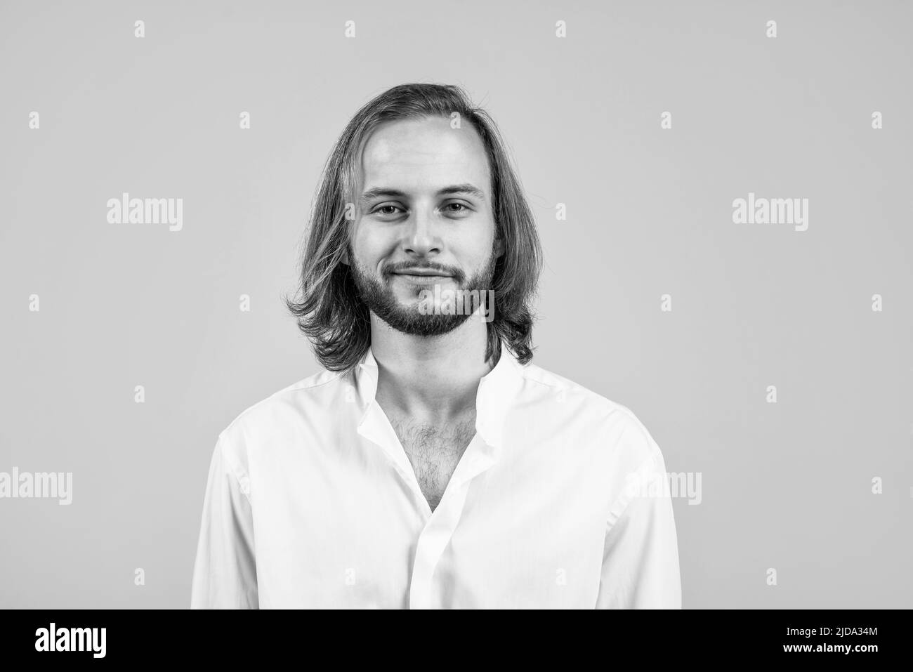 unshaven man with long hair. smiling happy man wear white office shirt ...