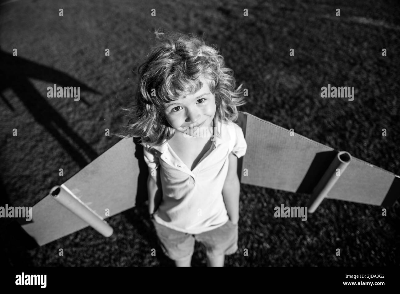 Funny child boy playing with toy jetpack. Child pilot astronaut or ...