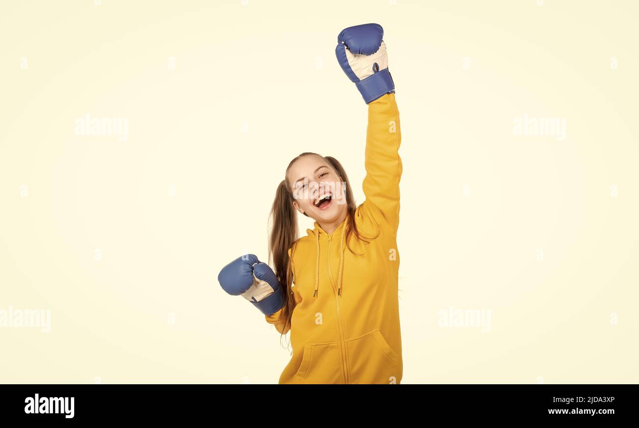happy child boxer in boxing gloves celebrating victory in fight ...