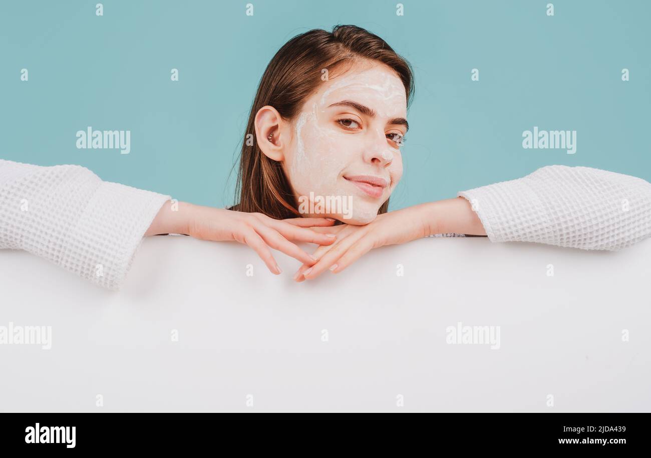 Beautiful girl model with facial mask cream, isolated. Banner with copy ...