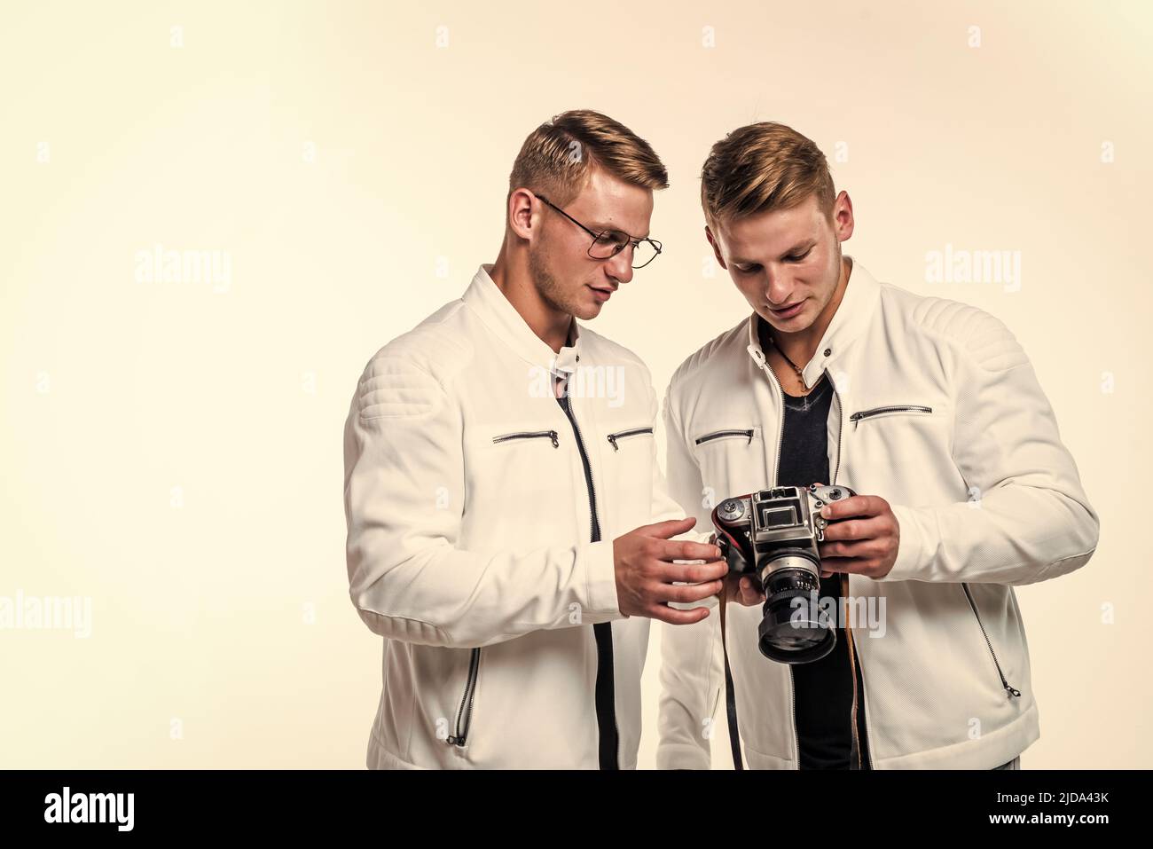 twin brothers men photographer in white casual look alike use vintage ...