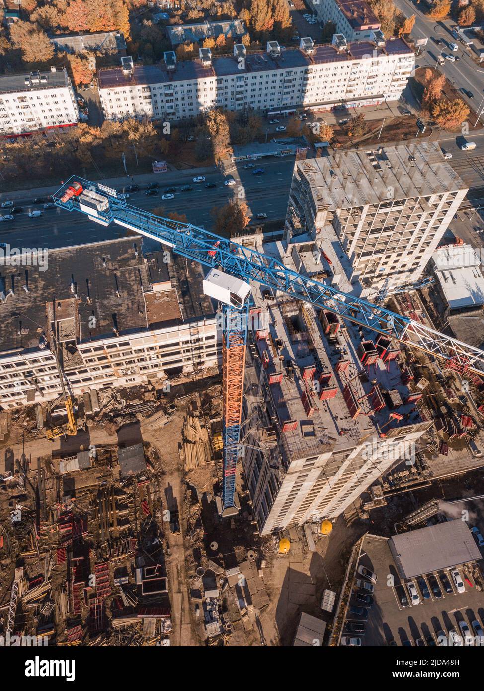 Aerial view of construction crane at building site. Industrial concept ...