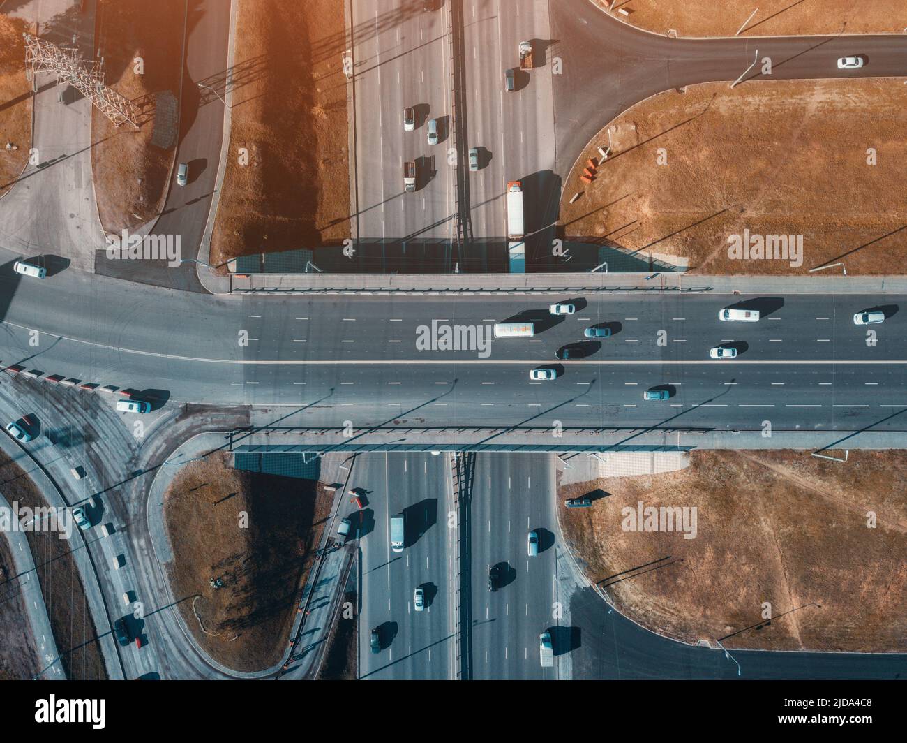 City crossroads and overpasses with traffic aerial view. Transport in ...
