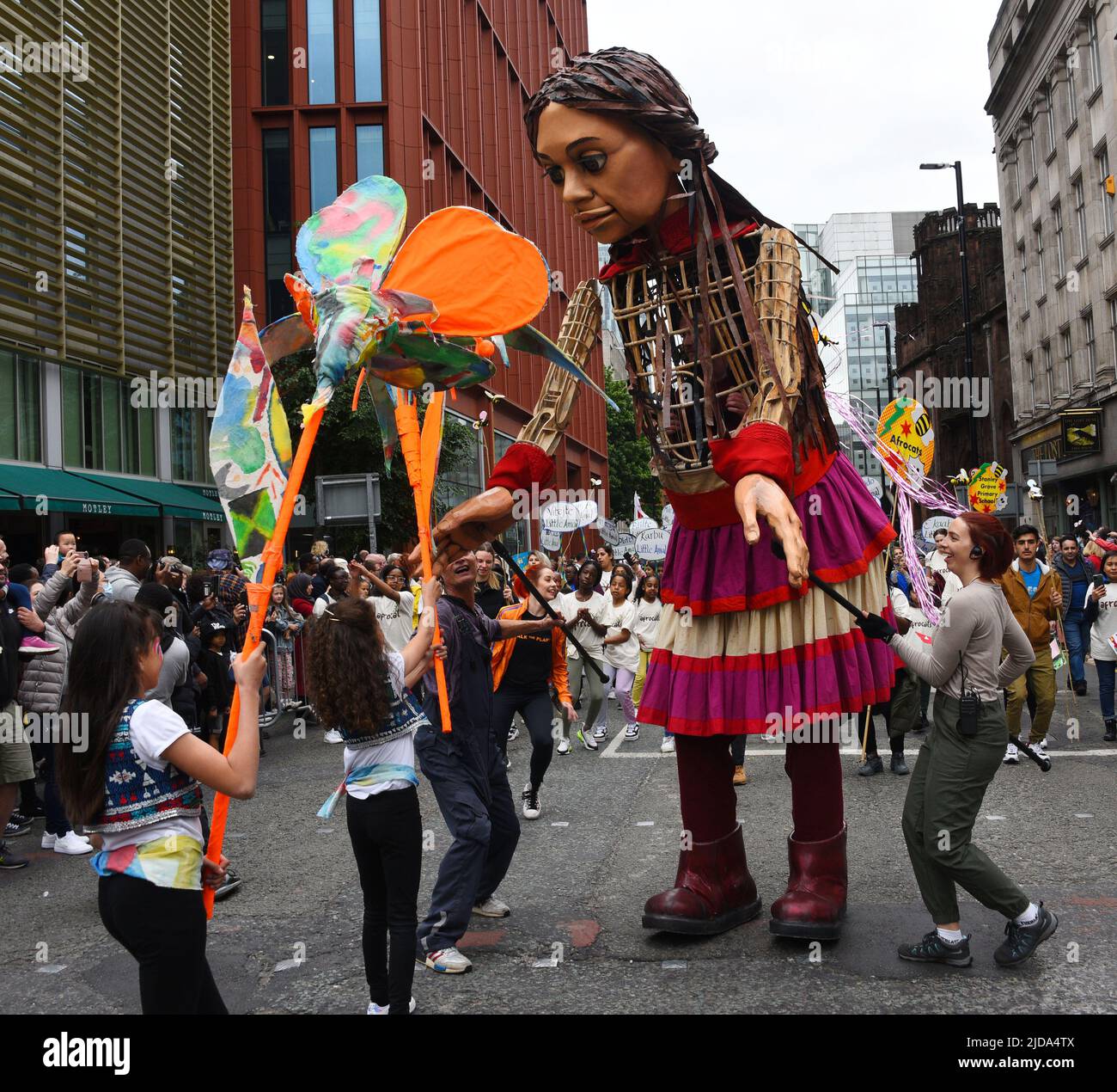 Manchester Day Parade 2022Amal srian refugee puppet with children in ...