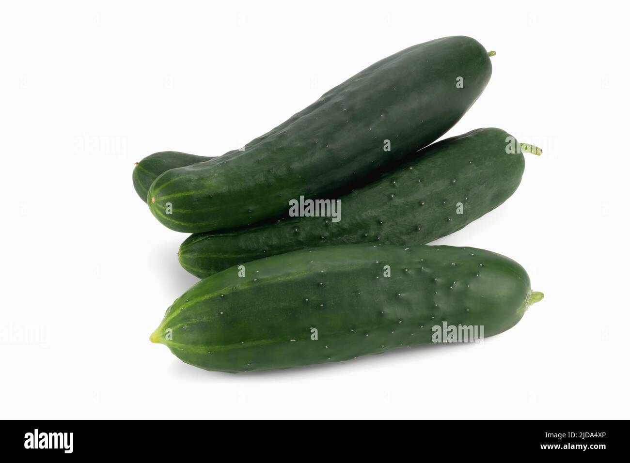 A pile of cucumbers isolated on white background. Close up view Stock ...