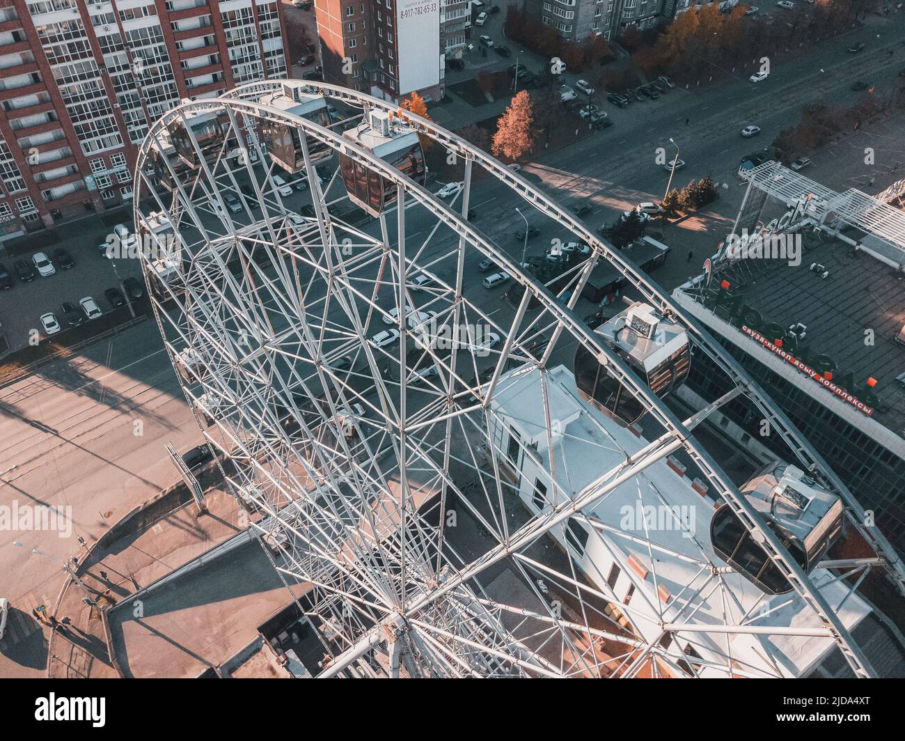 13 October 2021, Ufa, Russia: Aerial view of Ferris wheel among city ...