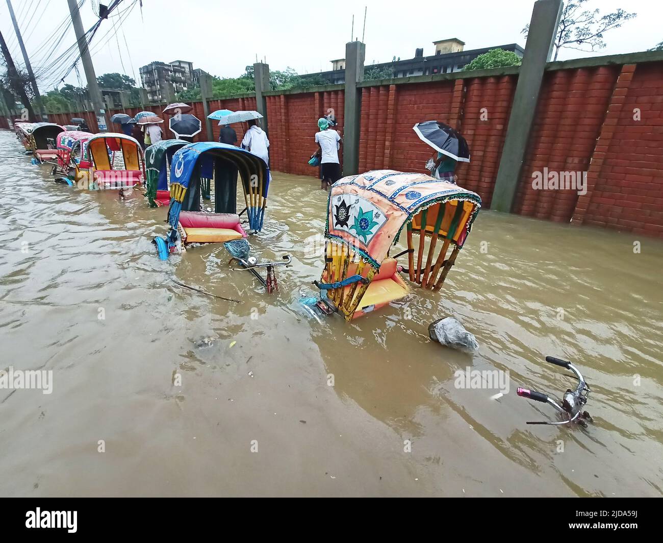 Sylhet, Bangladesh. 19th June 2022. Rickshaws stranded due to floods. The worst flooding in ...