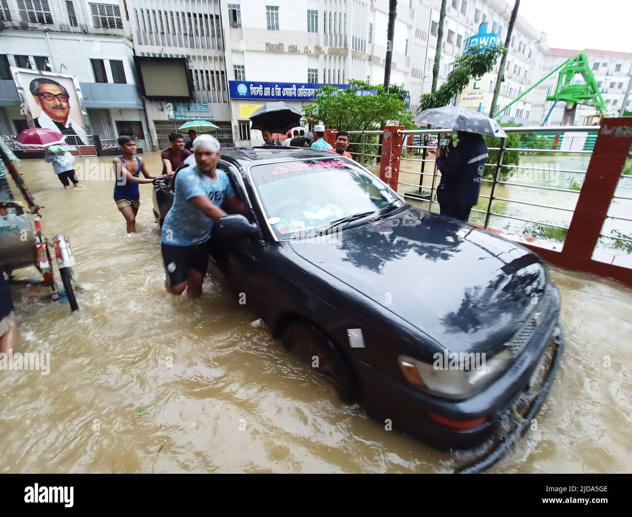 Sylhet, Bangladesh. 19th June 2022. Vehicles submerged in flood water. The worst flooding in ...