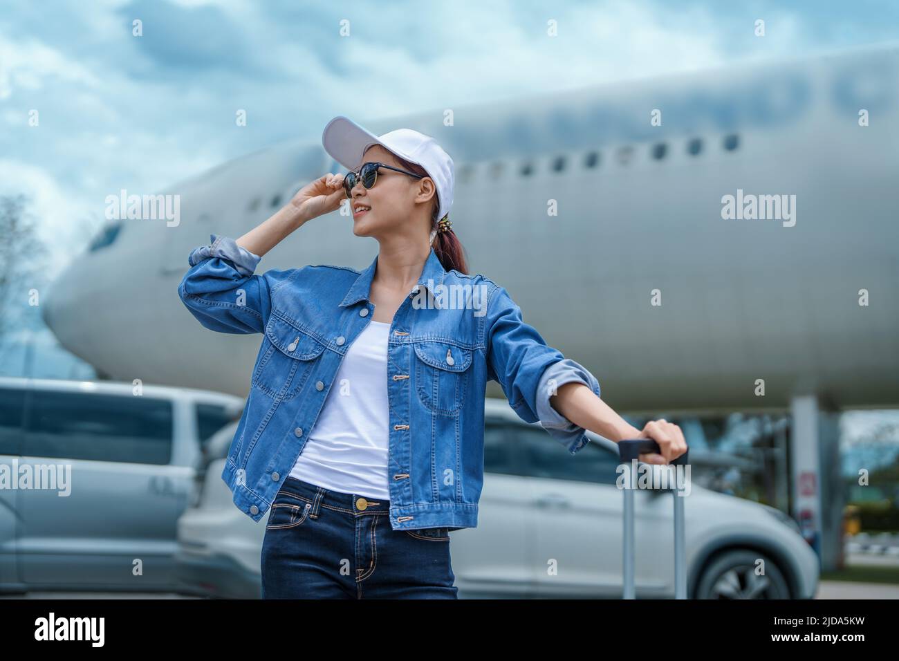 travel business Portrait of an Asian woman showing joy while waiting ...