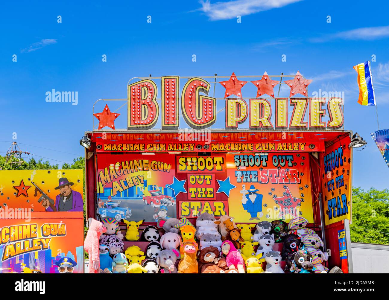 Machine gun alley carnival game at a fair Stock Photo - Alamy