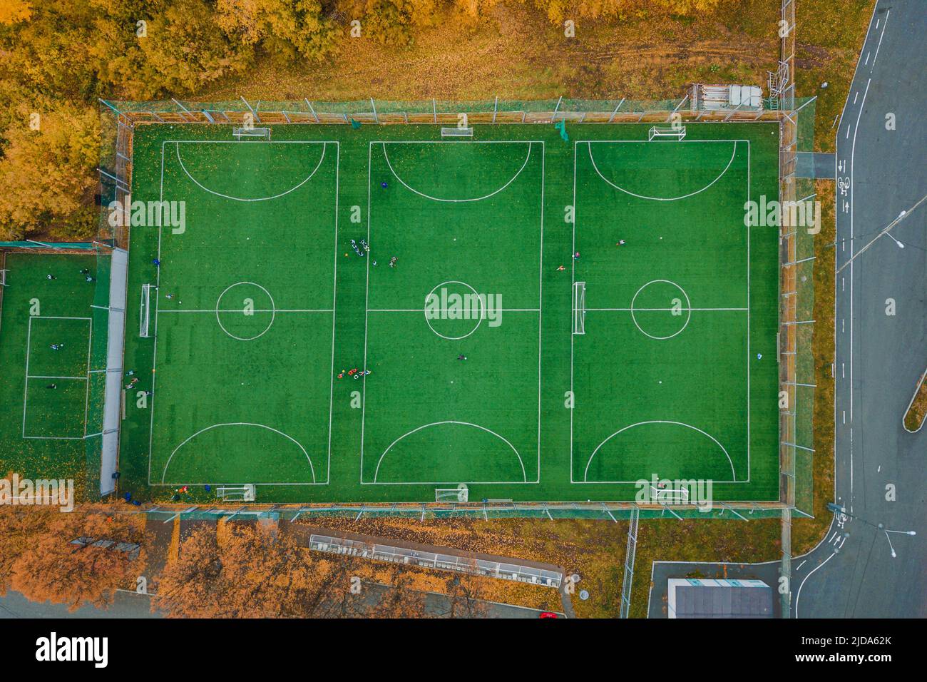 Aerial view of amateur mini football playground with practicing and ...