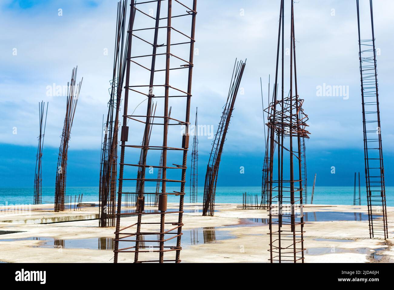 unfinished building with protruding rebar on the seashore Stock Photo ...