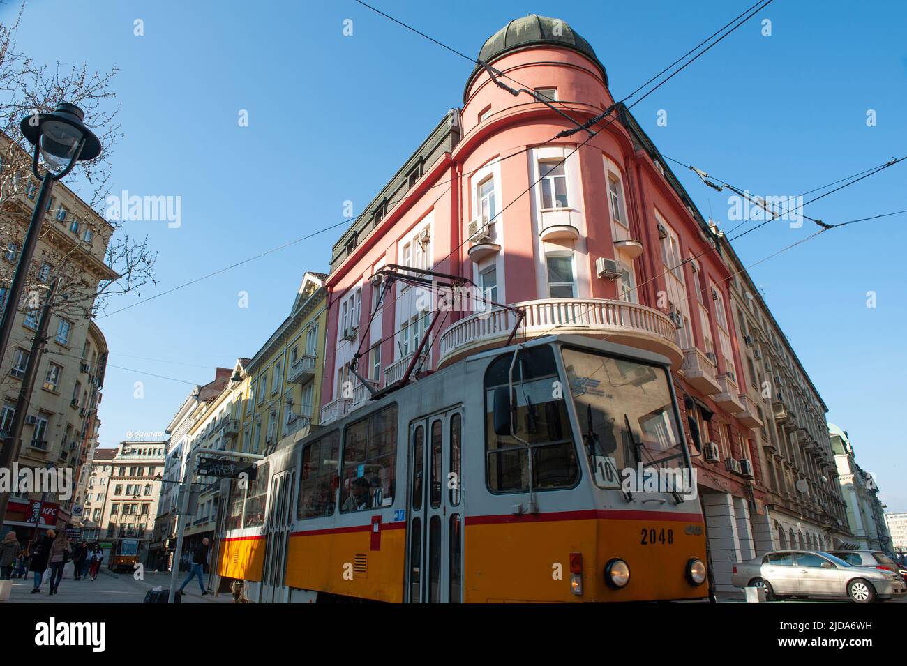 A local tram drives past the beautiful Bulgarian architecture in the ...