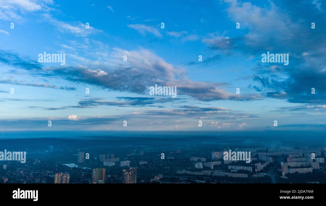 Blue morning cloudscape view in summer city residential district ...