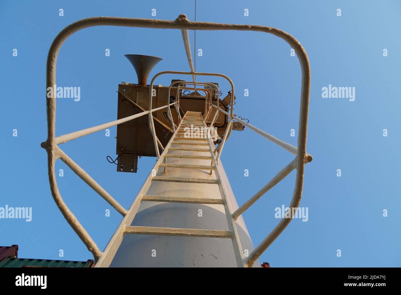 View on the ladder with protection railings to top of forward vessel ...