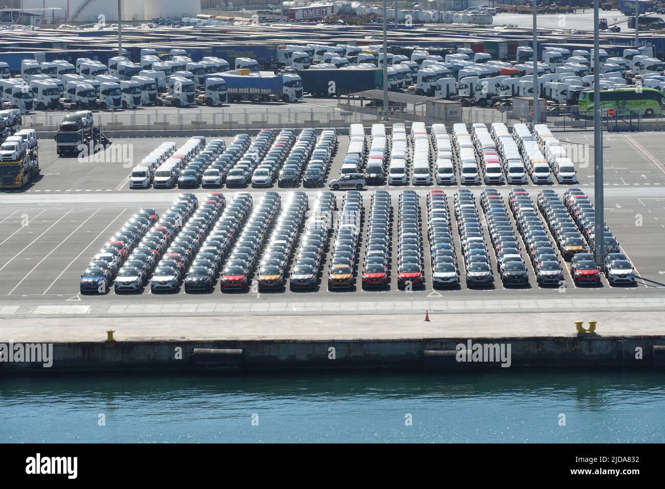 Recently discharged new cars, lorries and busses are parking in port of ...