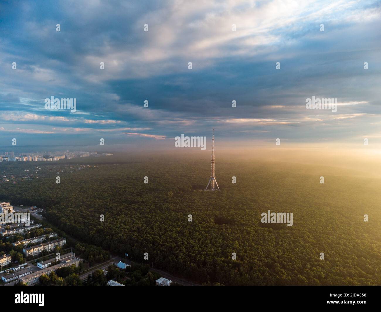 Aerial sunrise morning city view on telecom tower in forest near ...