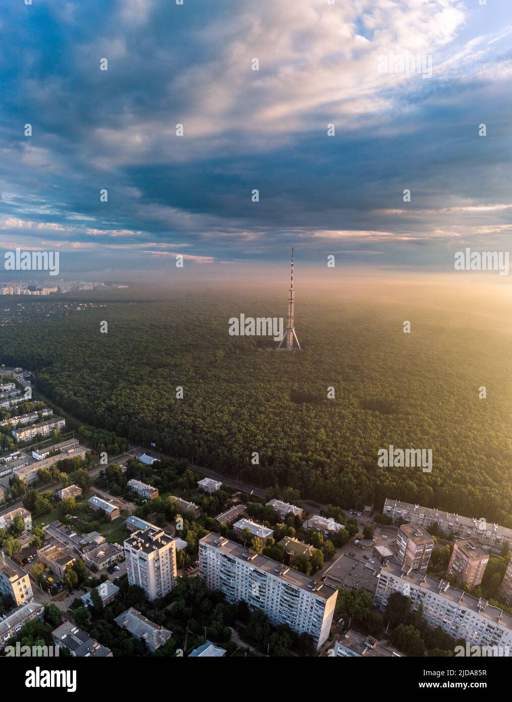 Aerial sunrise morning city view on telecommunication tower in forest ...