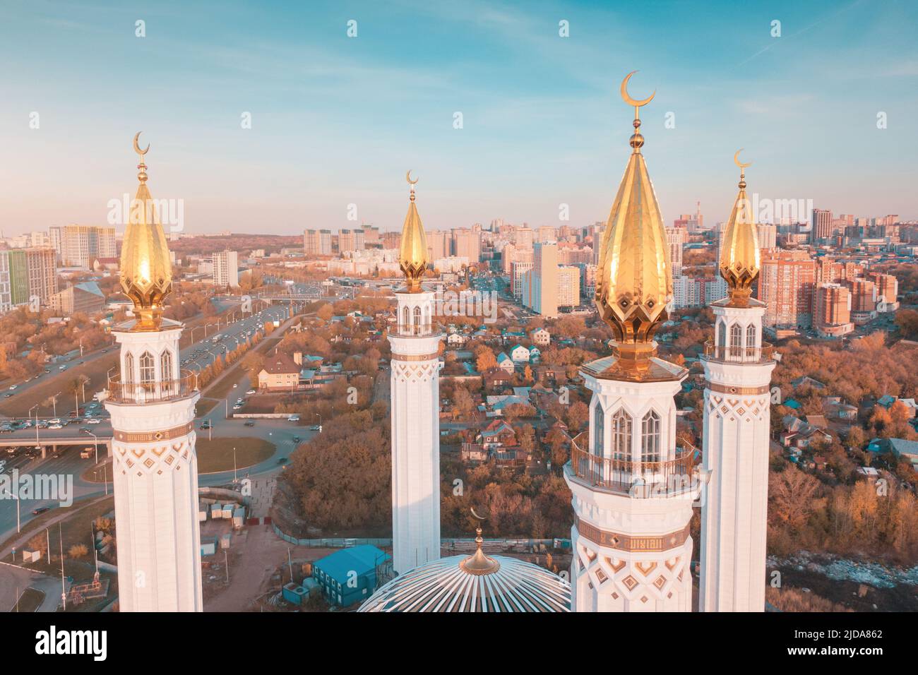 Aerial unusual view of minarets of a majestic mosque. Muslim and ...