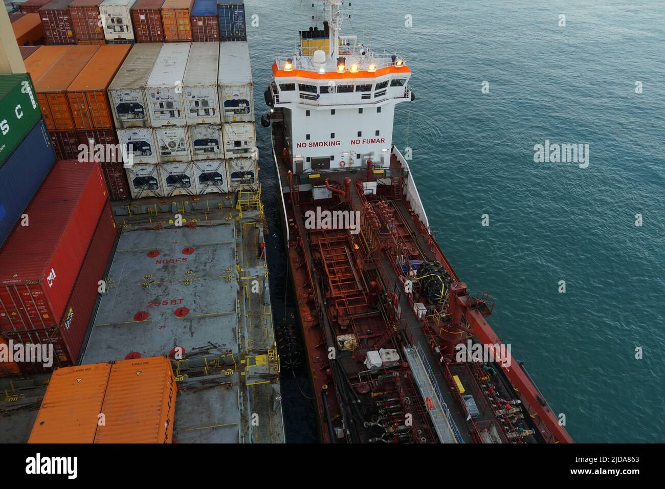 Aerial view on bunker barge with red hull and white superstructure ...