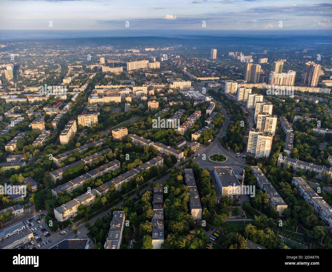 Sunny morning city view in summer green city, residential district ...