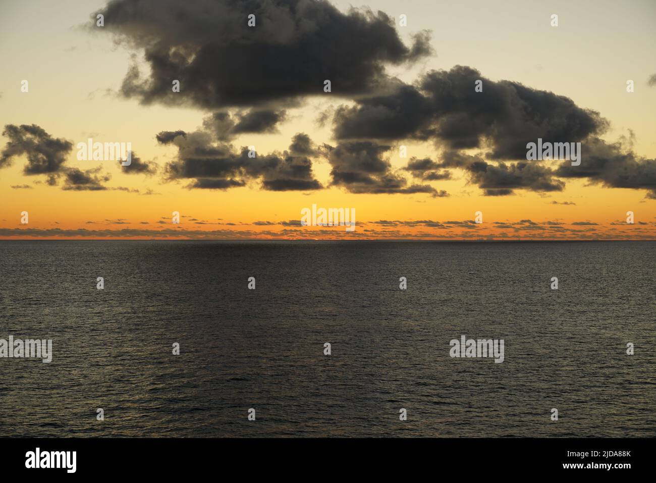 Sunset in Atlantic Ocean during calm weather in Summer season with the ...