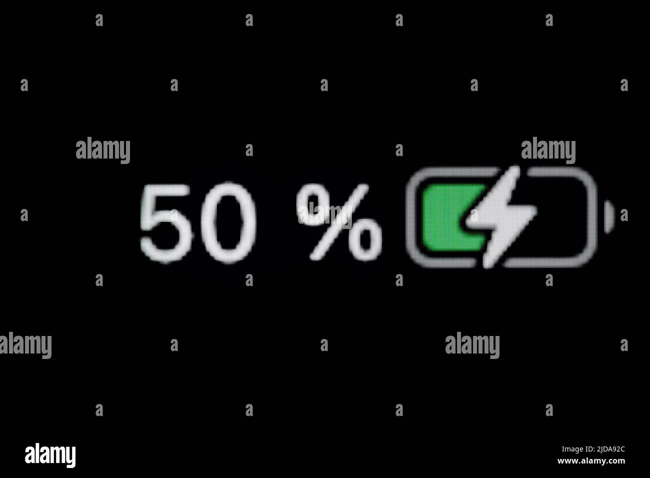 Smartphone charged battery level indicator - fifty, 50 percent: close ...