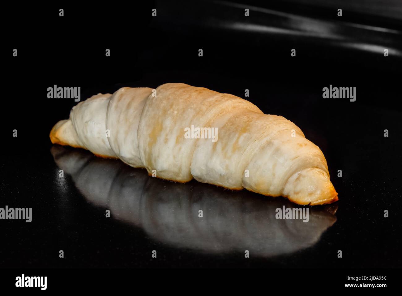 Homemade croissant baking and rising in electric oven: close up Stock ...