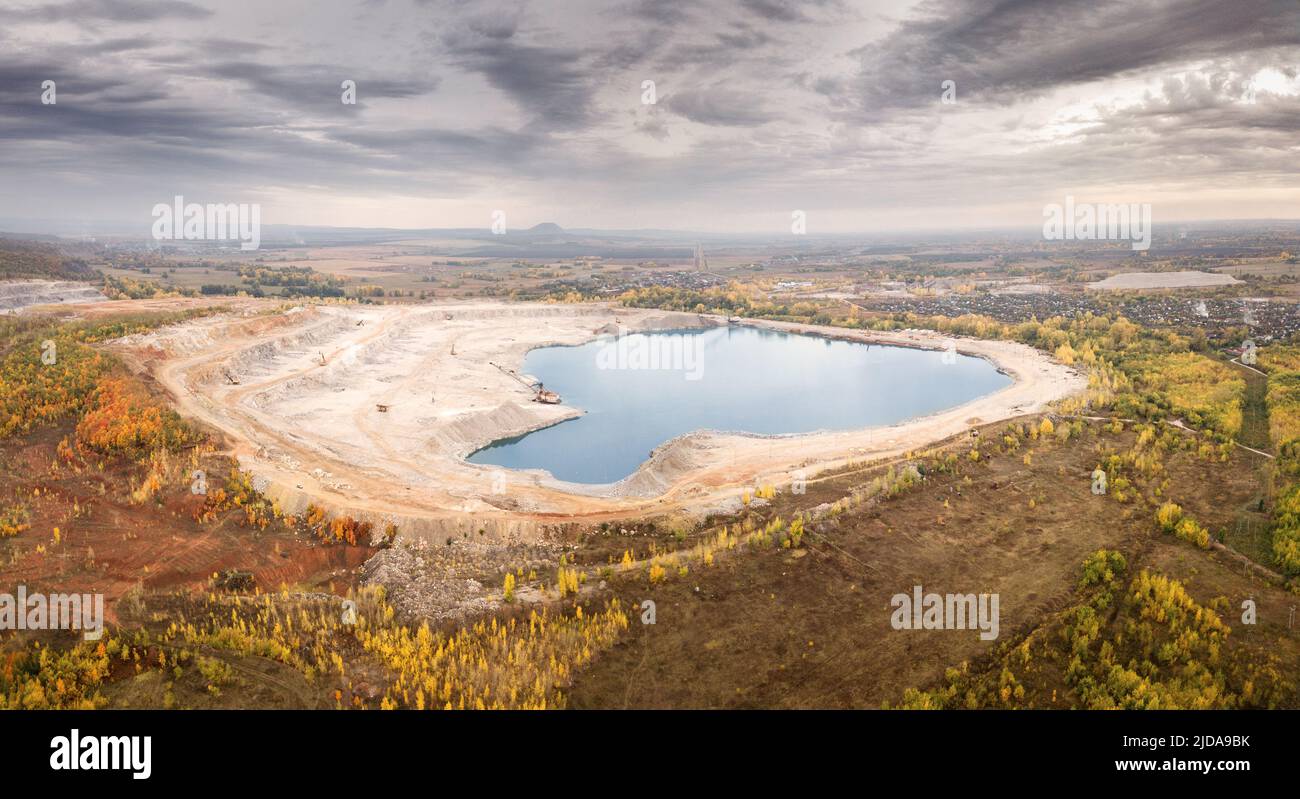 A flooded quarry producing soda and white limestone. The concept of ...