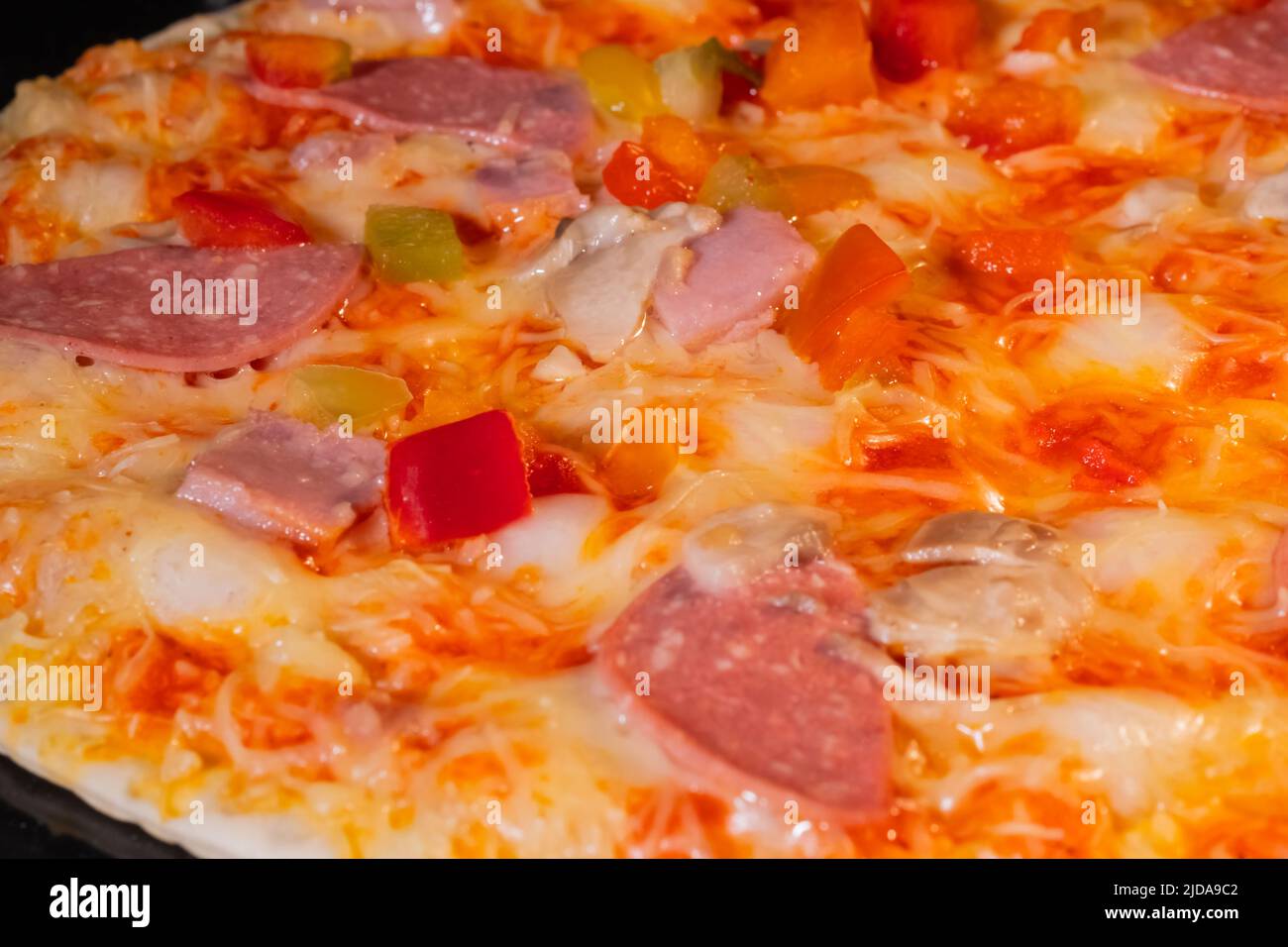 Baked homemade pizza in electric oven at home: close up Stock Photo - Alamy