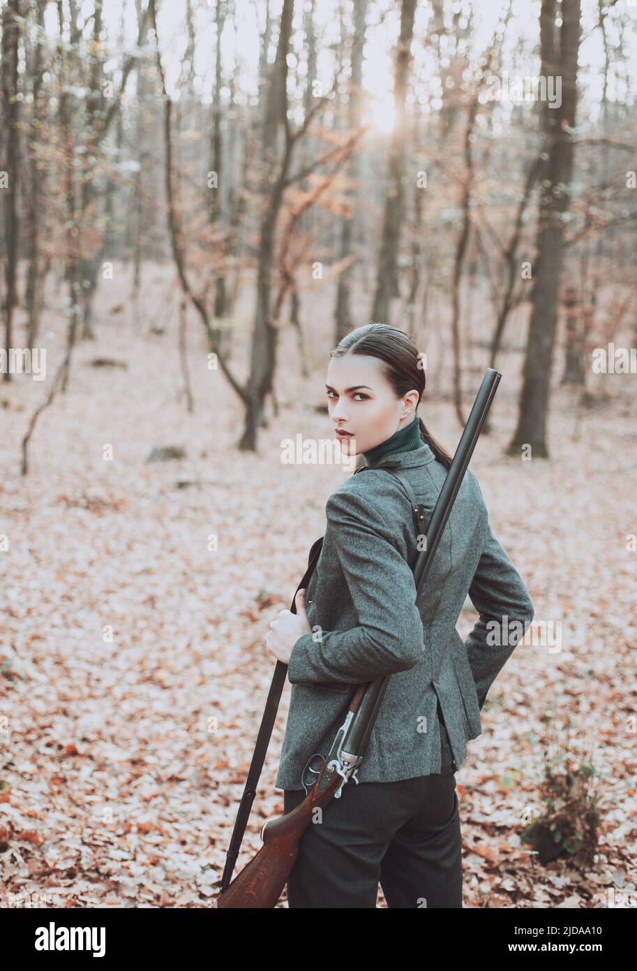 Hunter woman hunting. Hunting in autumn forest. Portrait of beauty ...