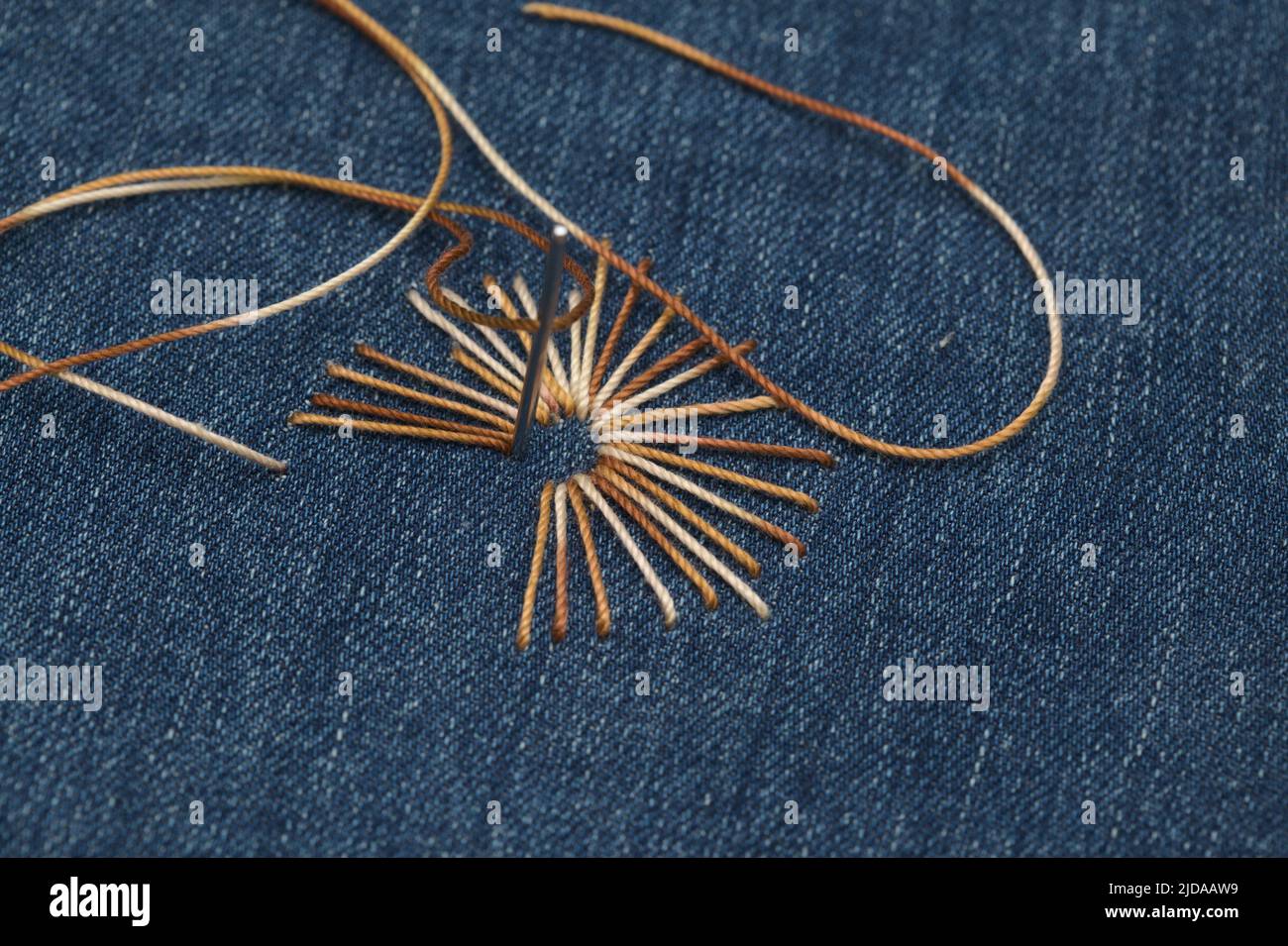 Freeform embroidery on a denim fabric Stock Photo - Alamy