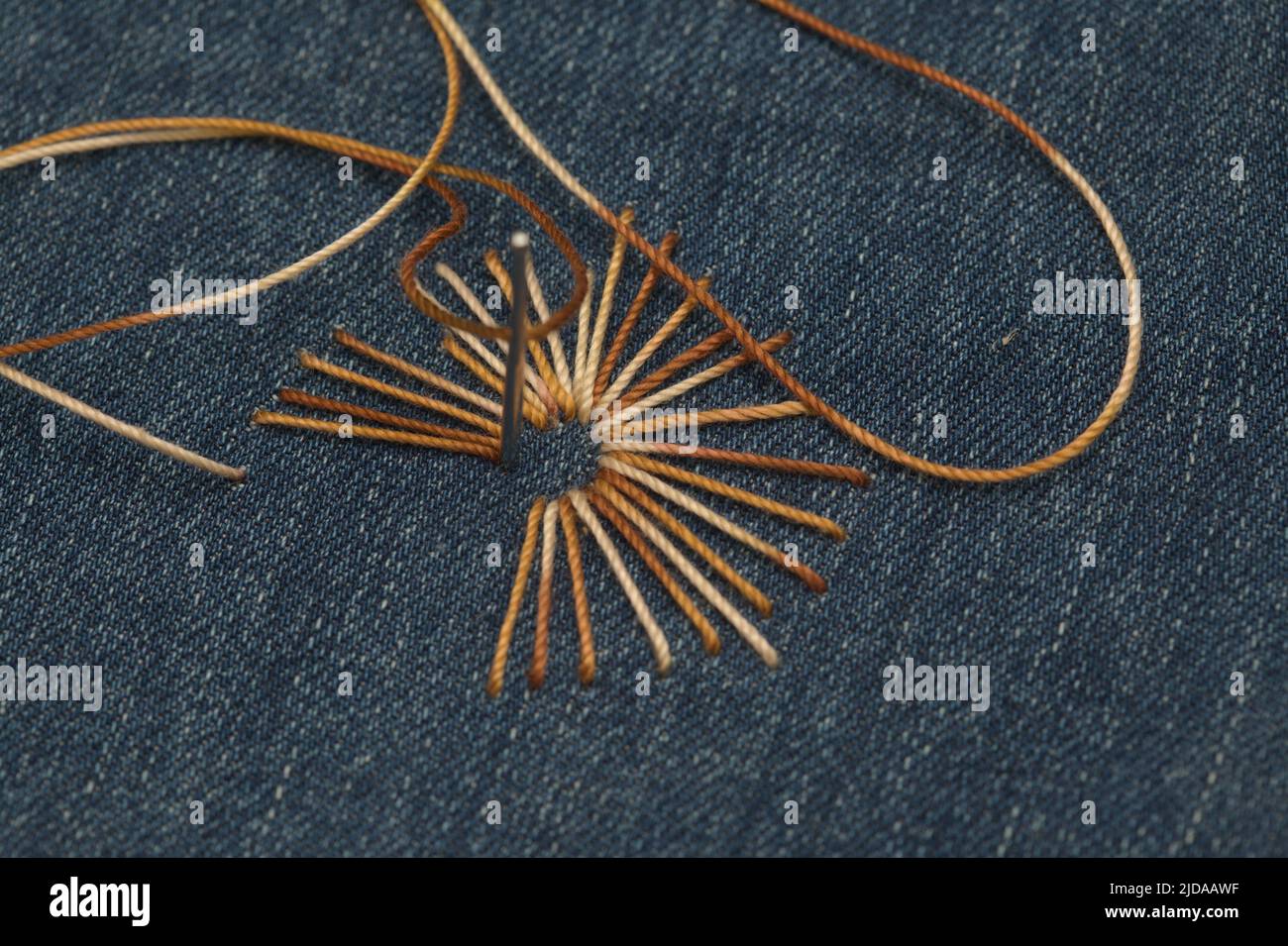 Freeform embroidery on a denim fabric Stock Photo - Alamy