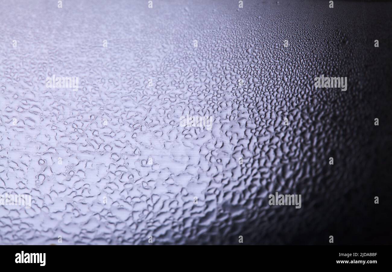 Macro background with water droplets condensation pattern on metal ...