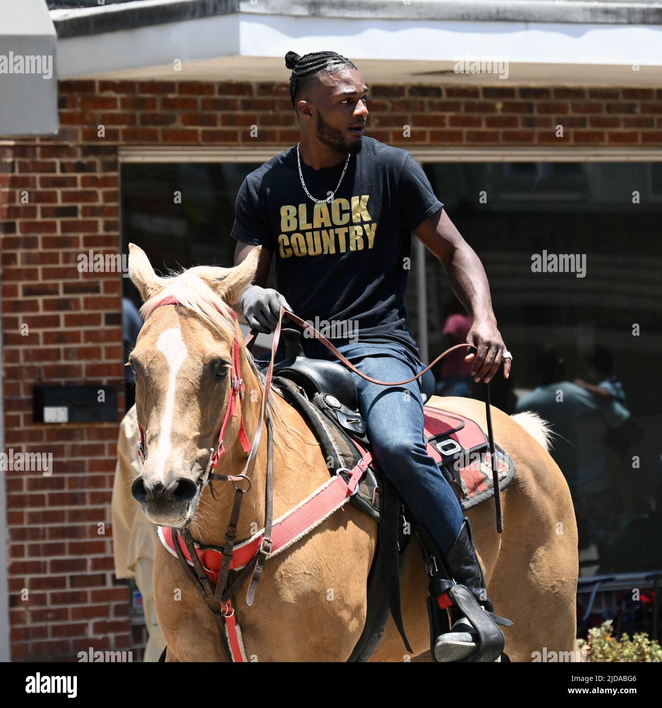 African American cowboys parade on horseback through Zebulon, NC, as ...