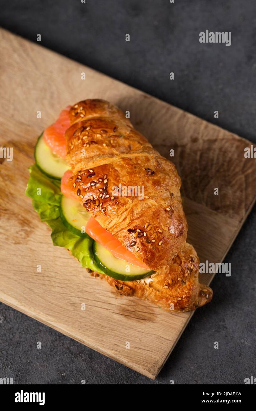The chef prepares the croissant with the filling Stock Photo - Alamy